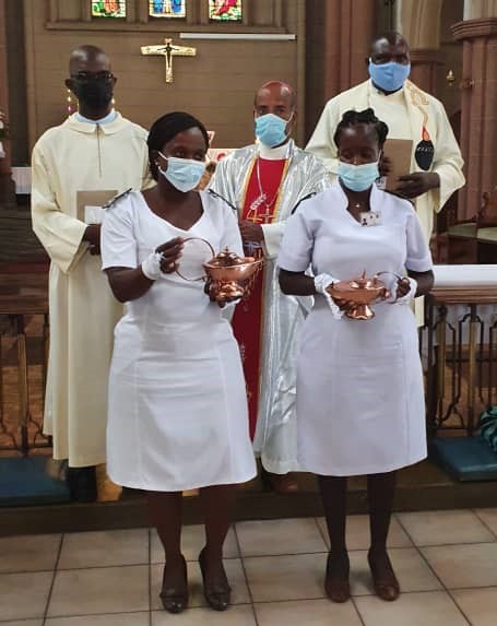 two-nurses-holding-nurses-lamp-symbolising-the-nurses-profession-stand ...