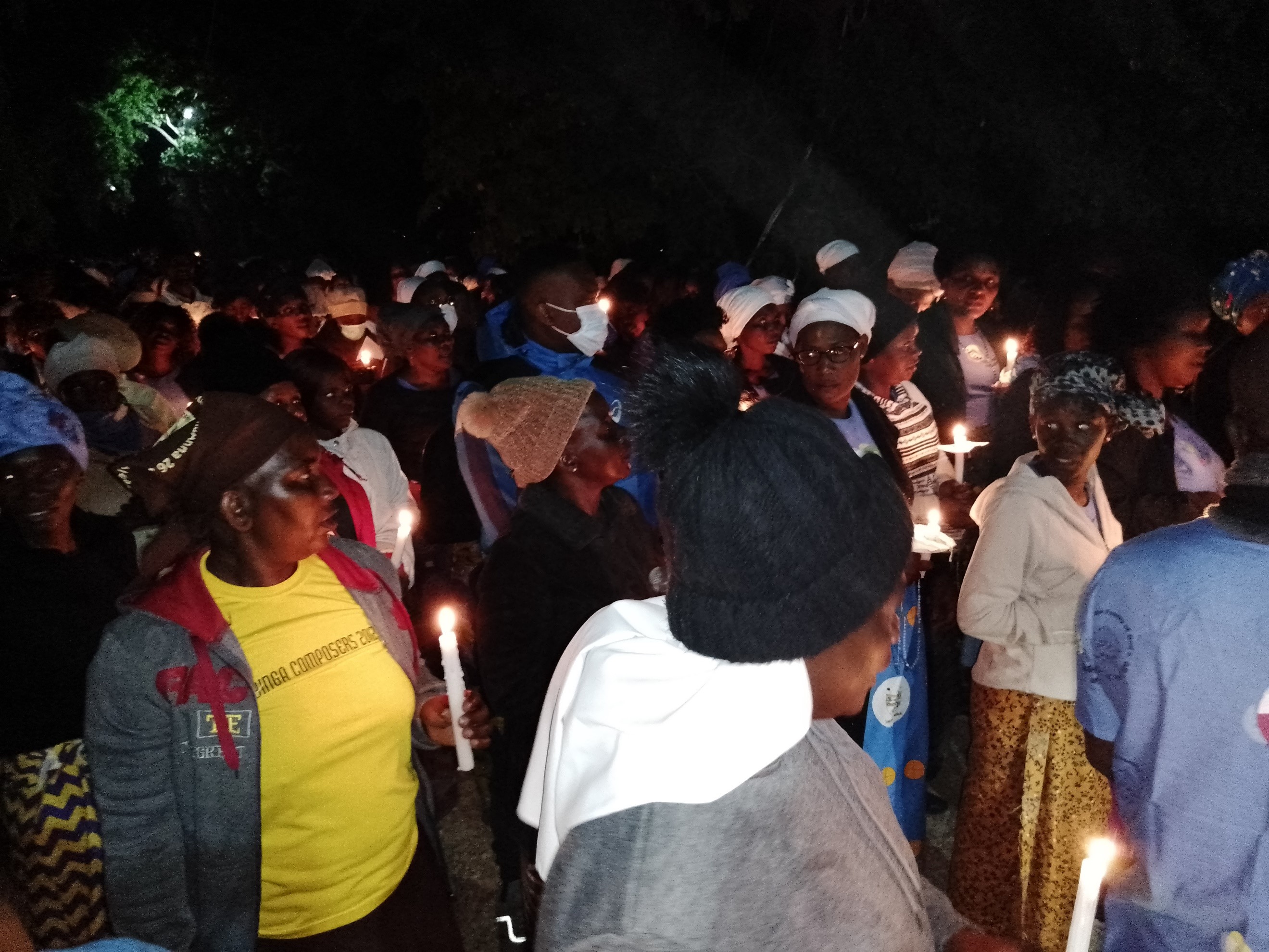 Pilgrims-light-candles-during-the-rosary-procession-around-the-Marian ...